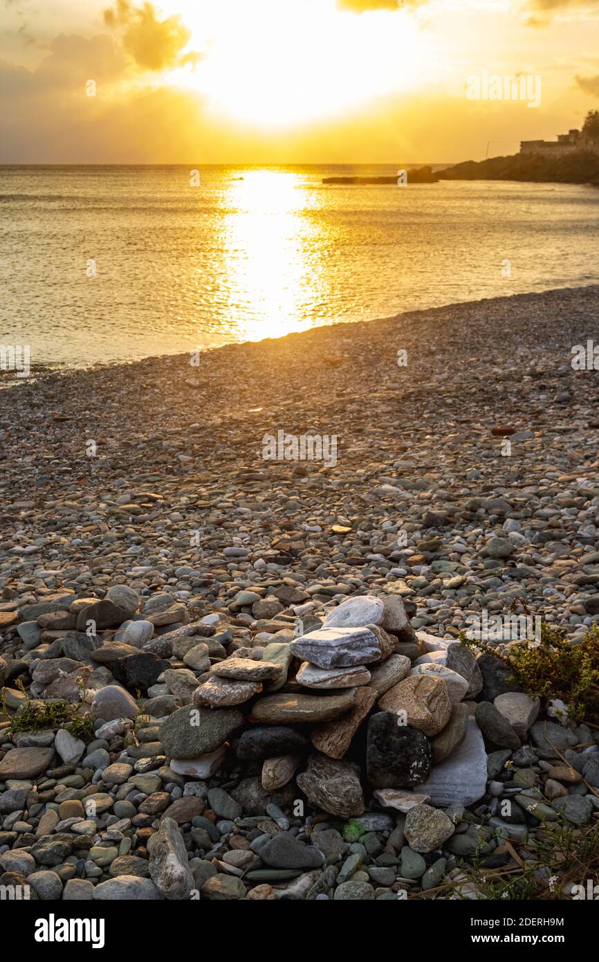 A vertical shot of a beautiful sunset on the beach Stock Photo - Alamy