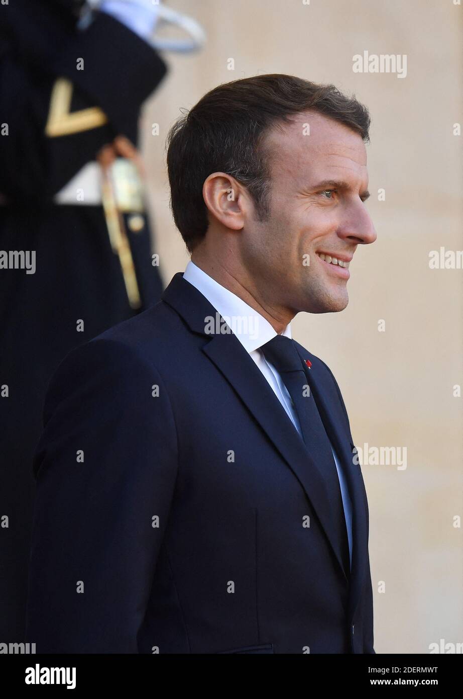 France's President Emmanuel Macron waits guests at the Elysee ...