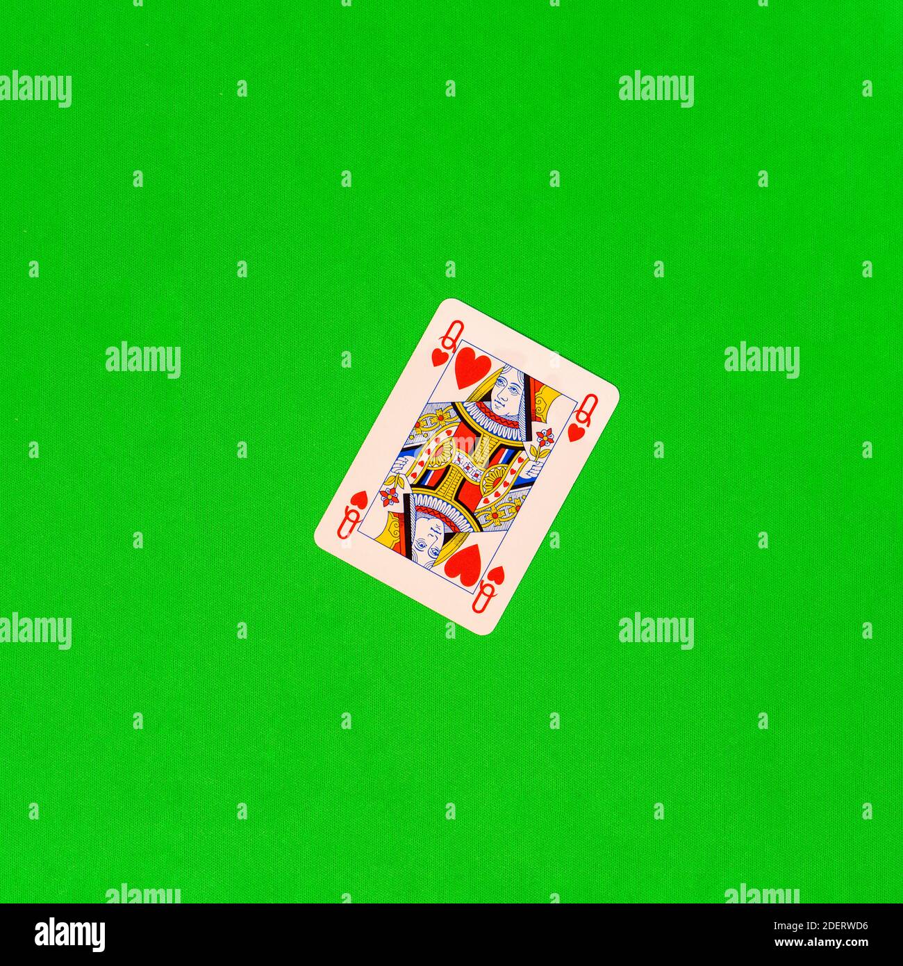 Playing card depicting the queen of hearts, poker card on colored ...