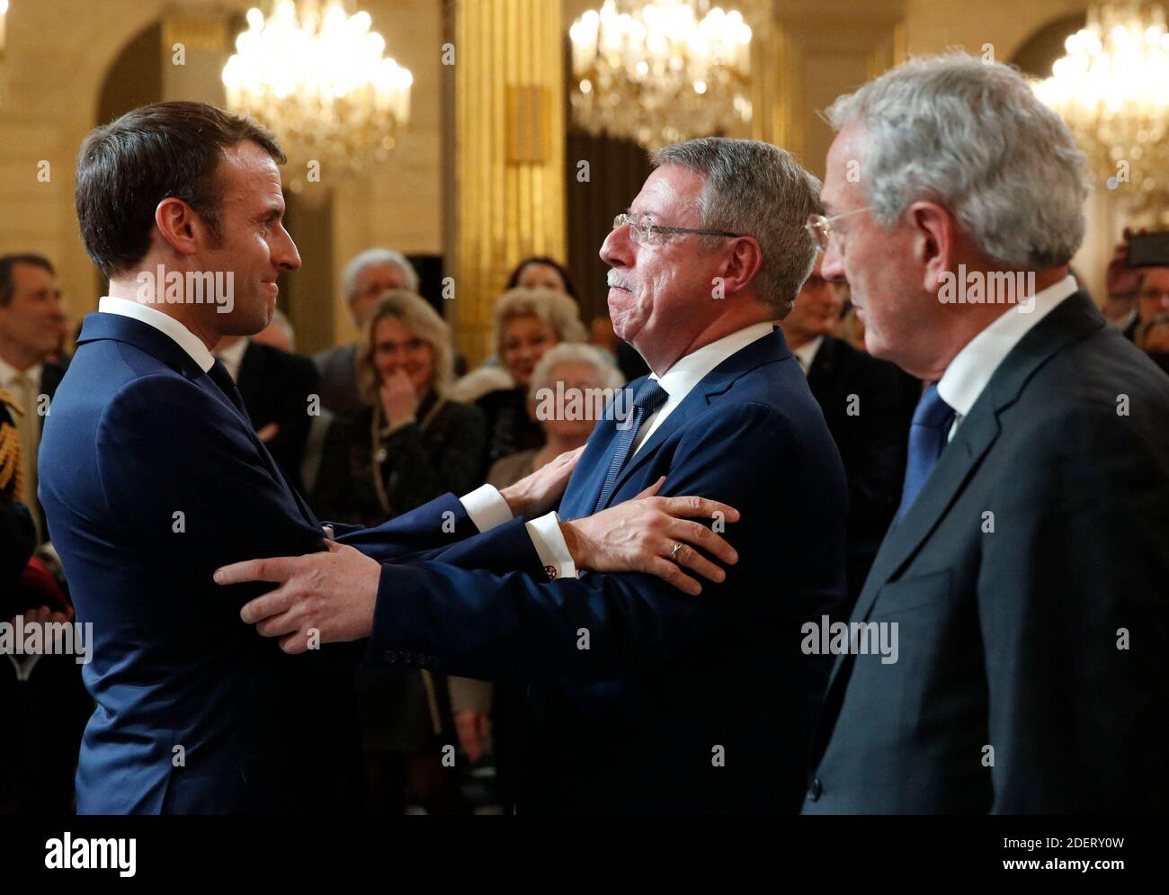 French President Emmanuel Macron awards Dominique Baert mayor of ...