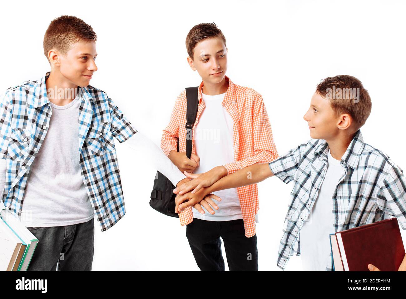 Teen guys give five to each other, teamwork, desire to win Stock Photo ...