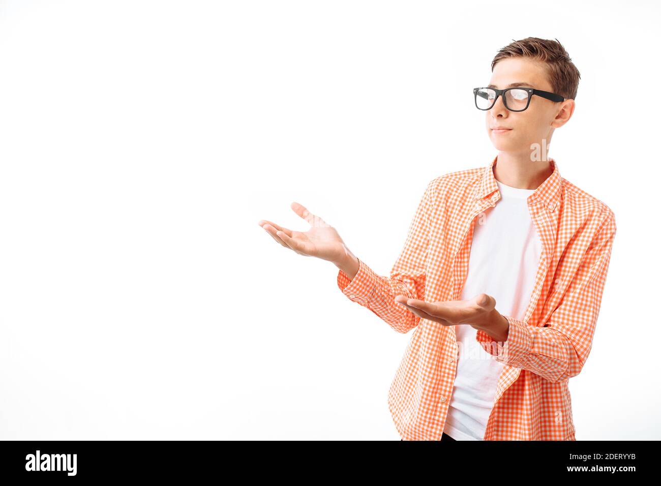 man pointing two hands at copy blank space, handsome young guy in ...