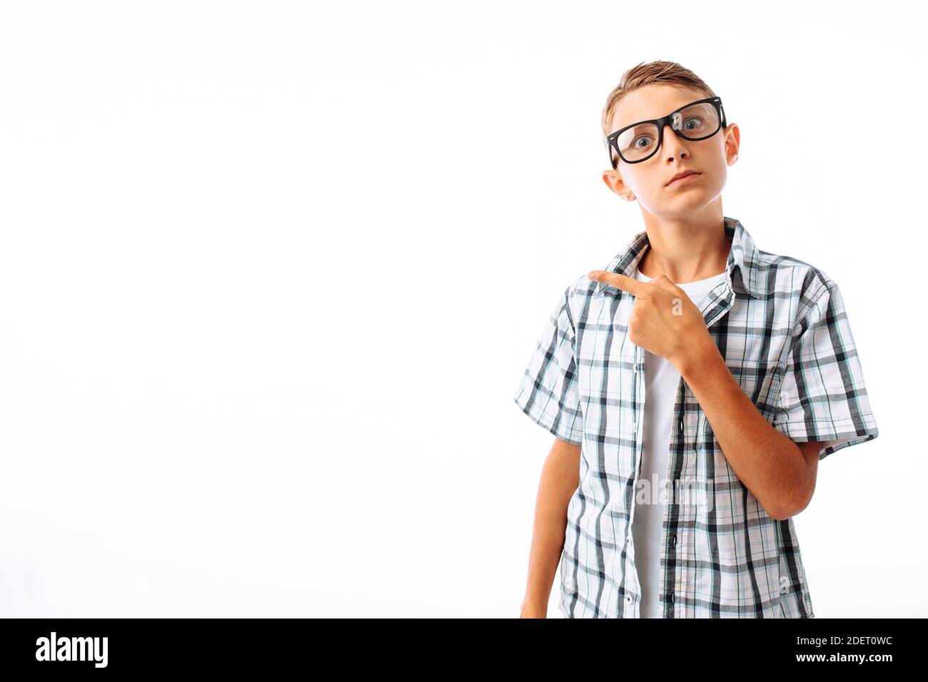 man pointing at copy blank space, handsome young guy in Studio on white ...