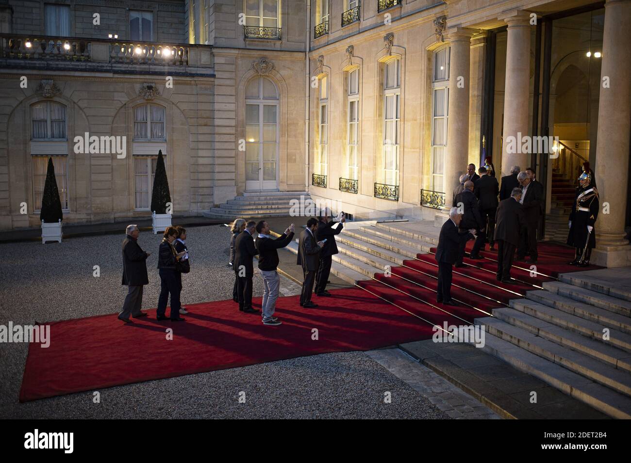 French mayors take pictures as they arrive at the Elysee Palace for a ...