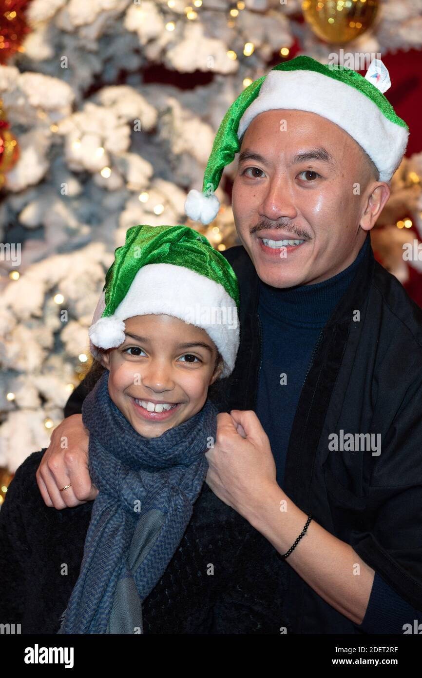 Steve Tran and his son attending the Peres Noel Verts launching ...