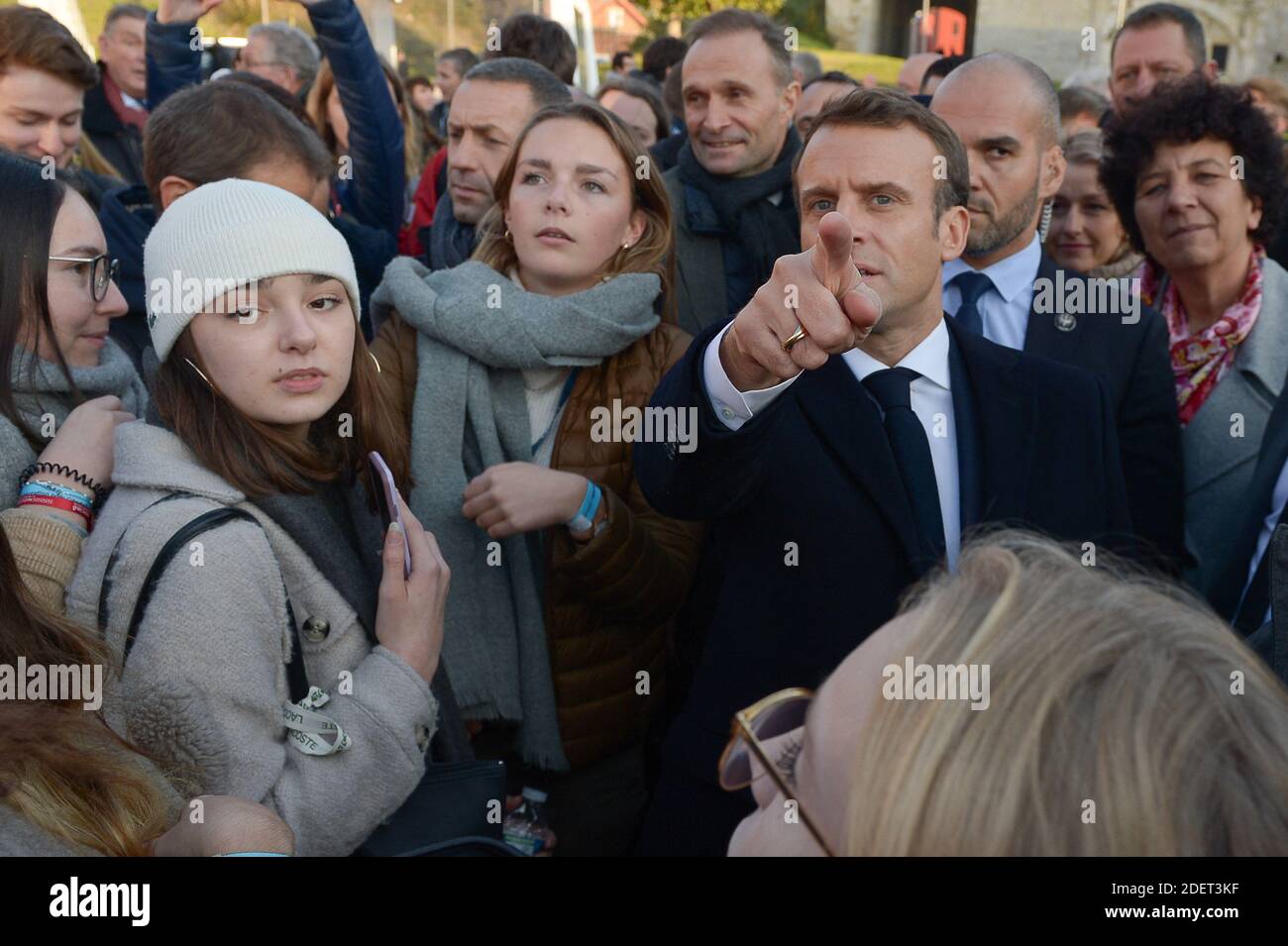 French President Emmanuel Macron is welcomed by students and teachers ...