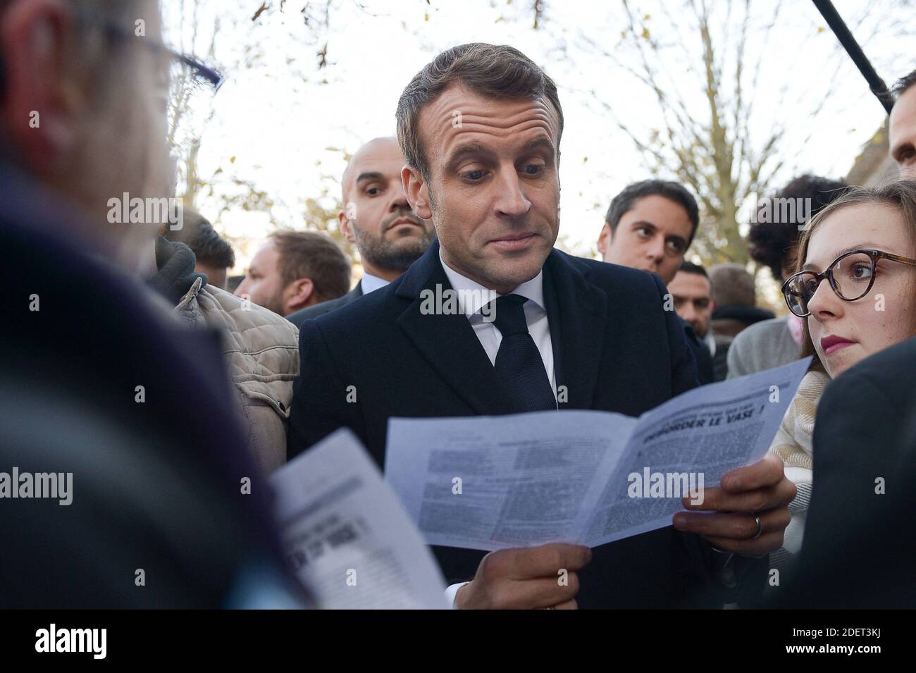French President Emmanuel Macron is welcomed by students and teachers ...