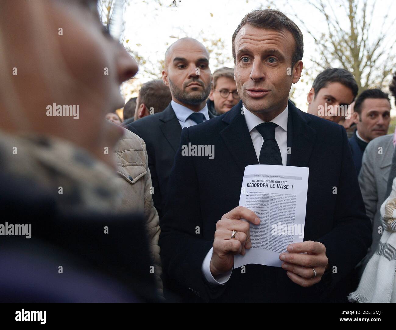 French President Emmanuel Macron is welcomed by students and teachers ...
