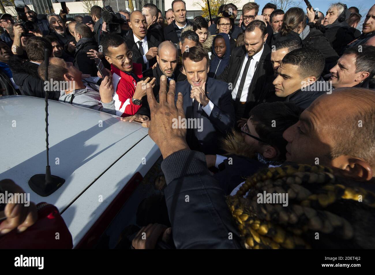 CORRECT CAPTION - President Emmanuel Macron during a crowd bath in ...