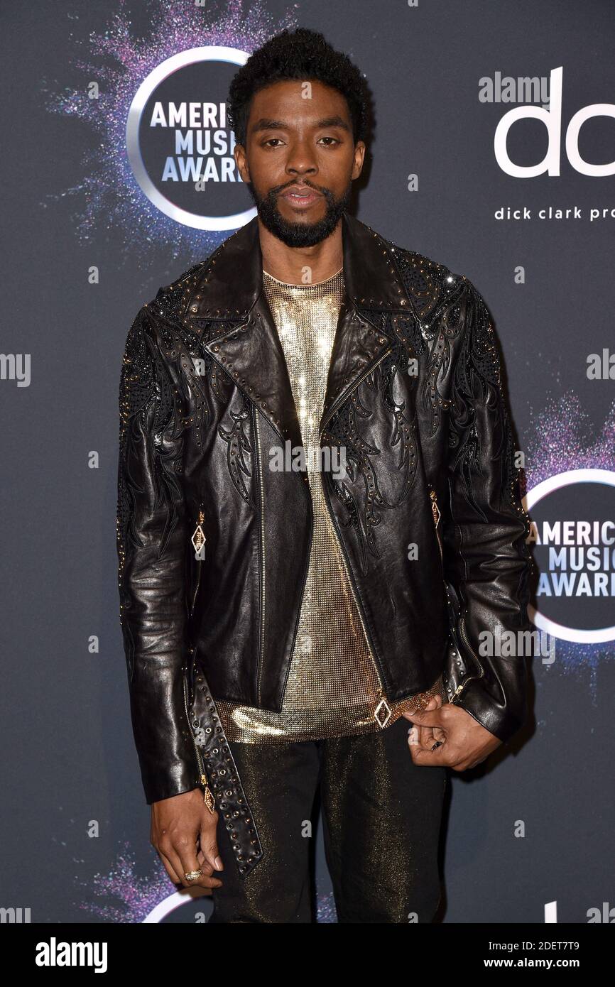 Chadwick Boseman poses in the press room during the 2019 American Music ...