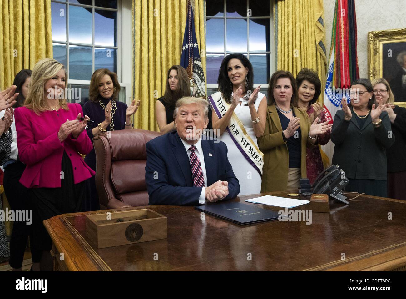 US President Donald J. Trump (C) delivers remarks during a signing ...