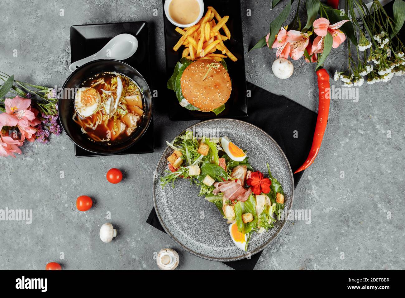 three-course business lunch. Lunch with burger asian ramen noodles and ...