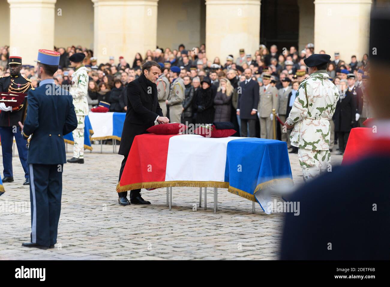 Emmanuel Macron in front of coffins.French President Emmanuel Macron ...