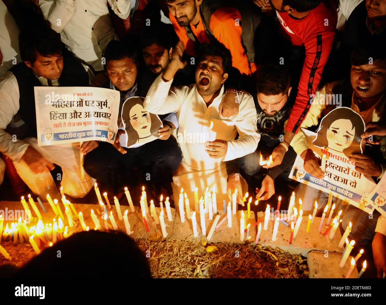 Indian Youth Congress (IYC) activists raise slogans during a ...