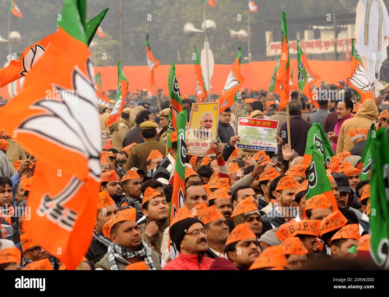 A supporter of the Bharatiya Janata Party (BJP) awaits the arrival of ...