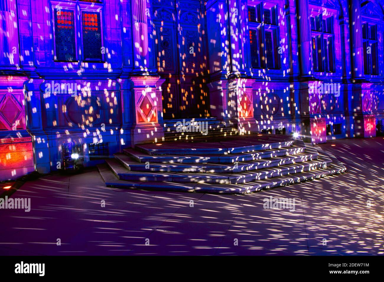 Reflected lights on the building facade . Christmas colorful ...