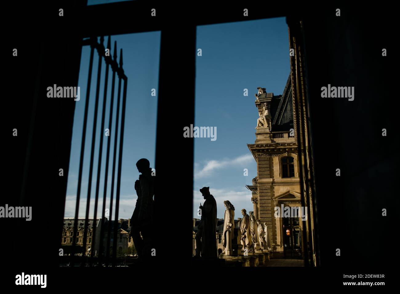 Indoor Window View of Statues on Top of the Louvre in Paris Stock Photo ...