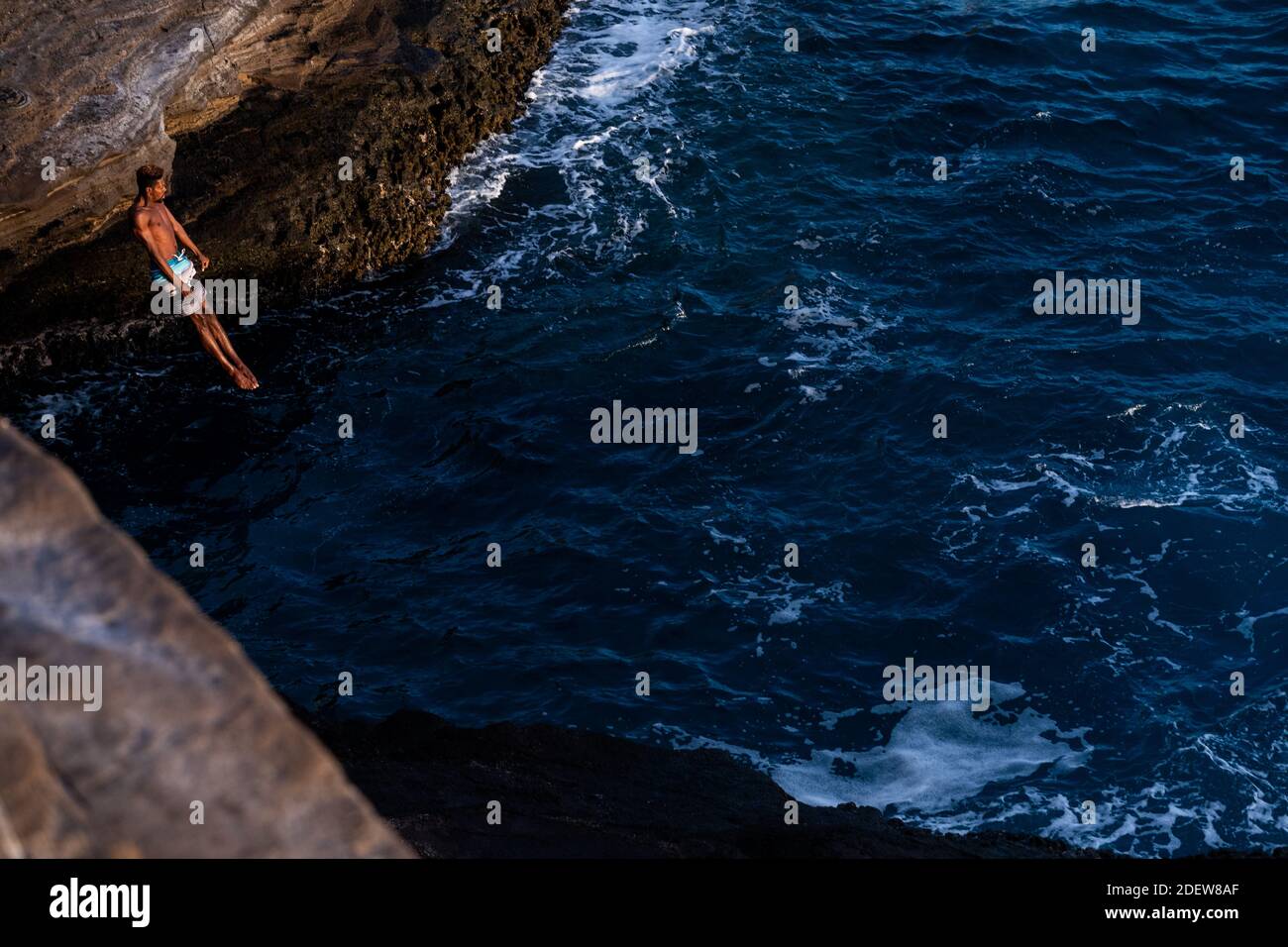 male cliff diver in action at the ocean cliffs of oahu, hawaii Stock ...