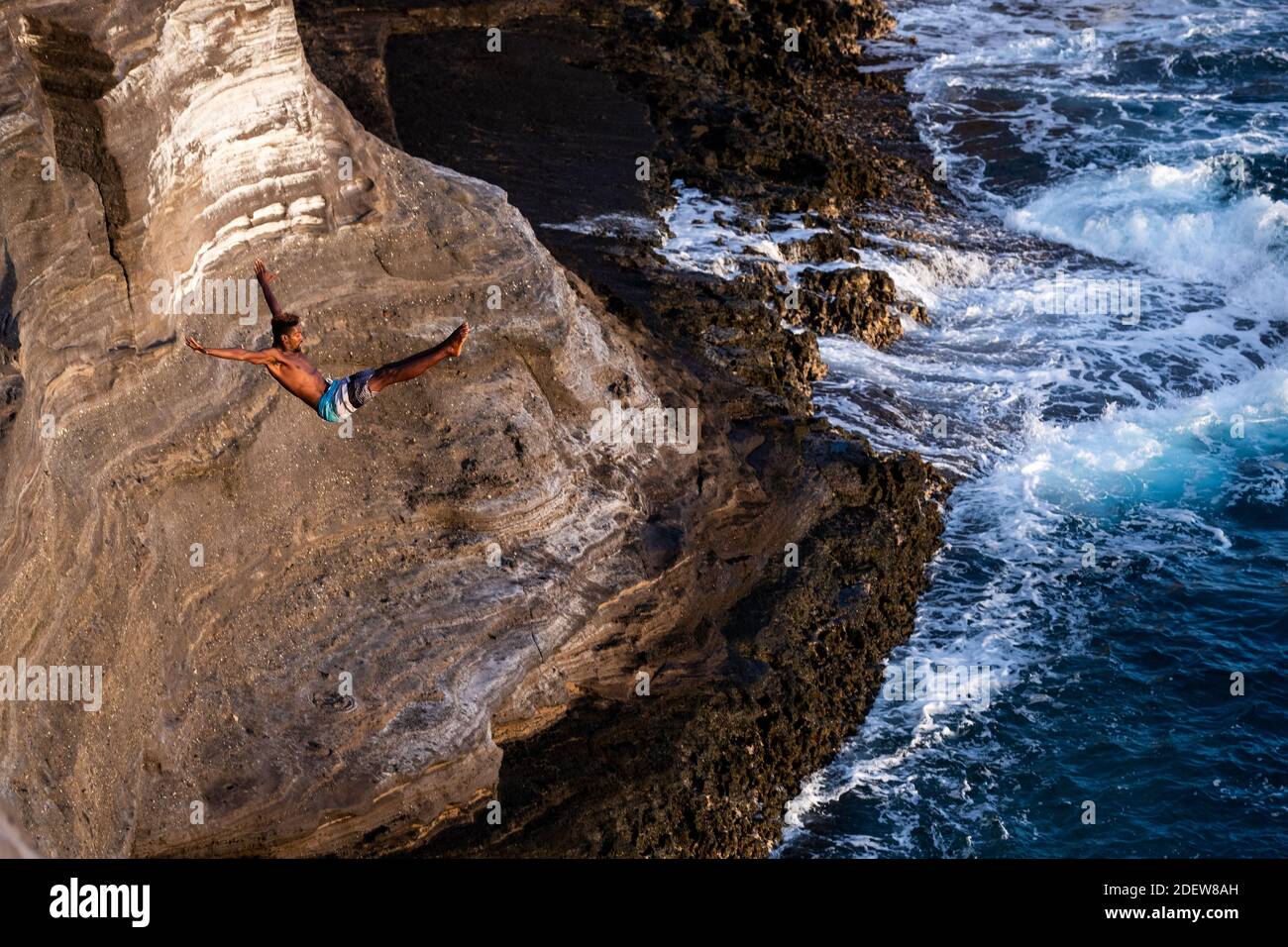male cliff diver in action at the ocean cliffs of oahu, hawaii Stock ...