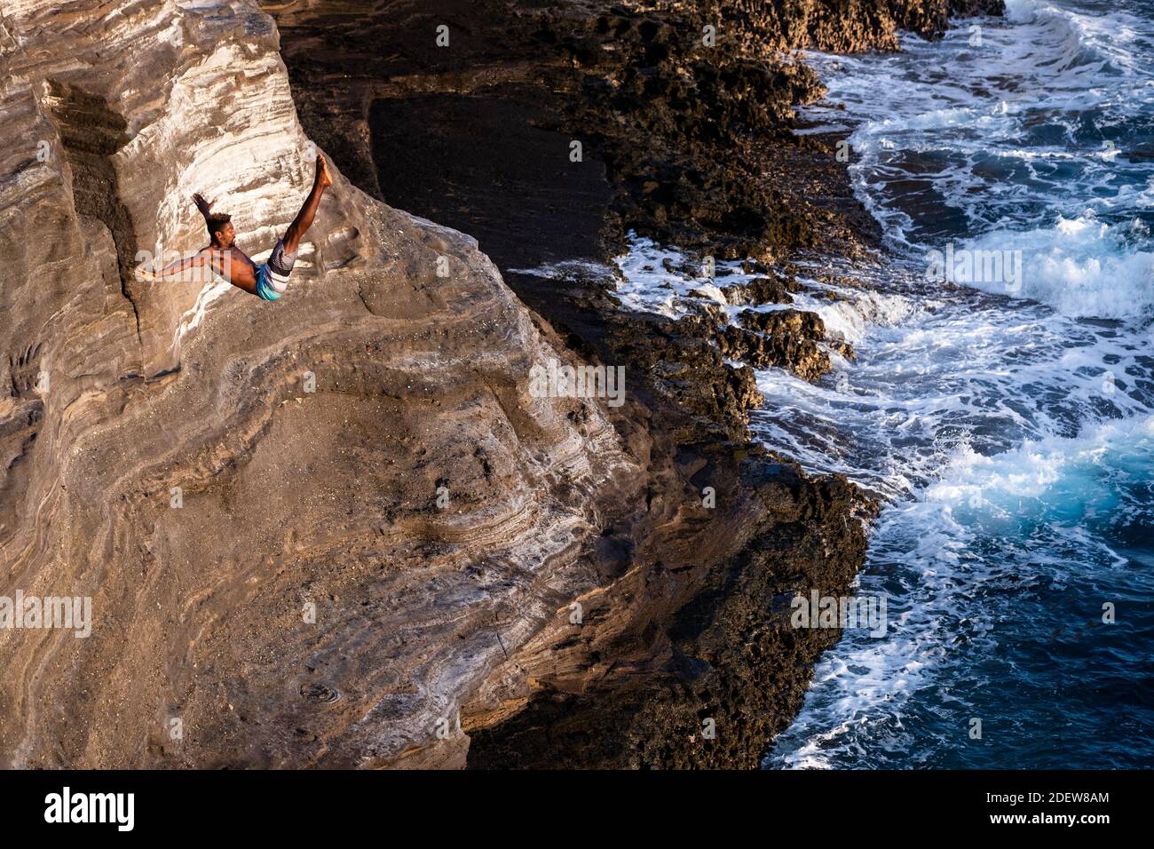 male cliff diver in action at the ocean cliffs of oahu, hawaii Stock ...