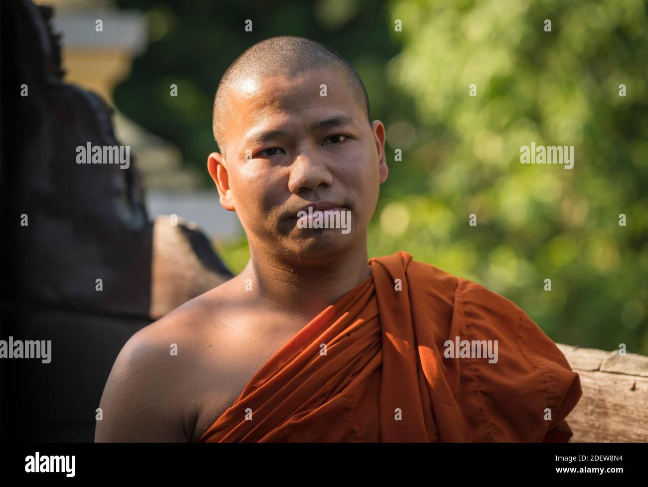 Portrait of a Buddhist monk dressed in orange robe, Mandalay, Myanmar ...