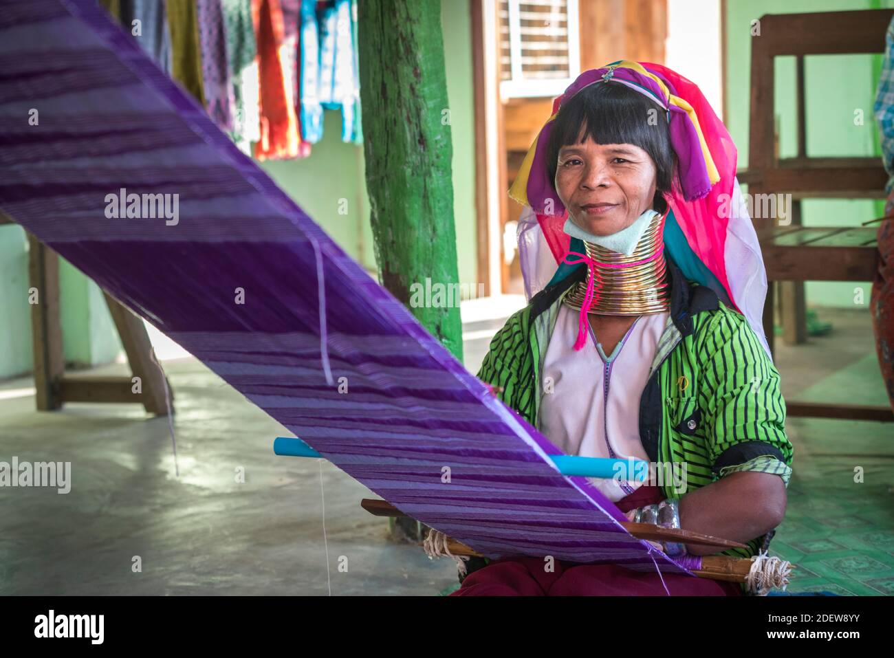 Adult Burmese woman from Kayan tribe (AKA Padaung, long-neck) weaving ...