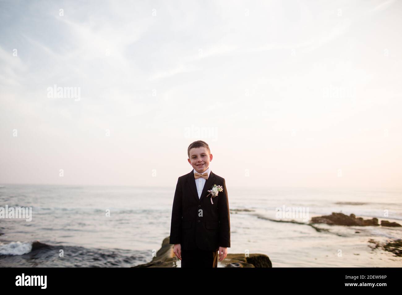 Nine Year Old Boy in Tux on Beach in San Diego Stock Photo - Alamy