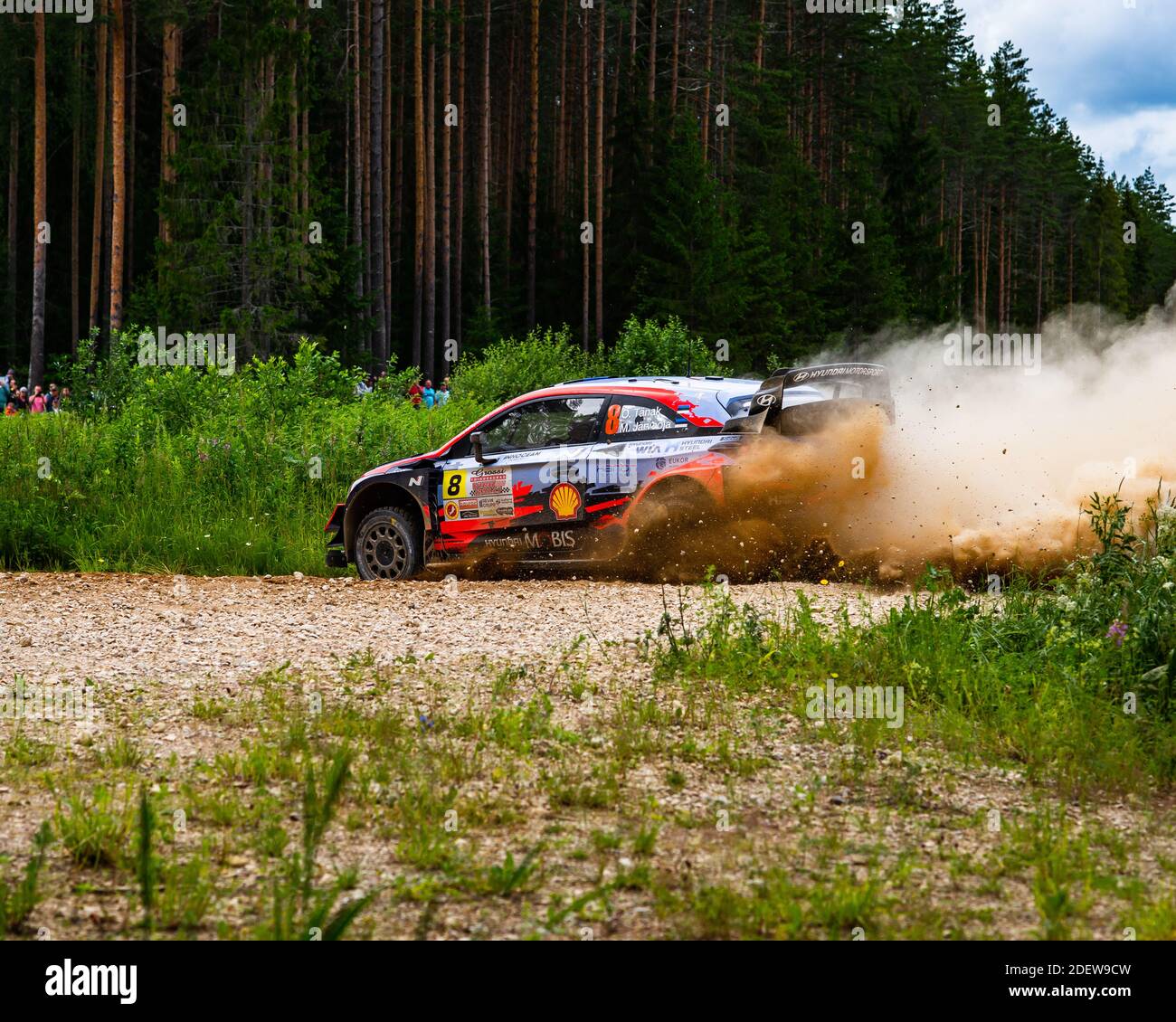Fast rally car driving in muddy road Stock Photo - Alamy