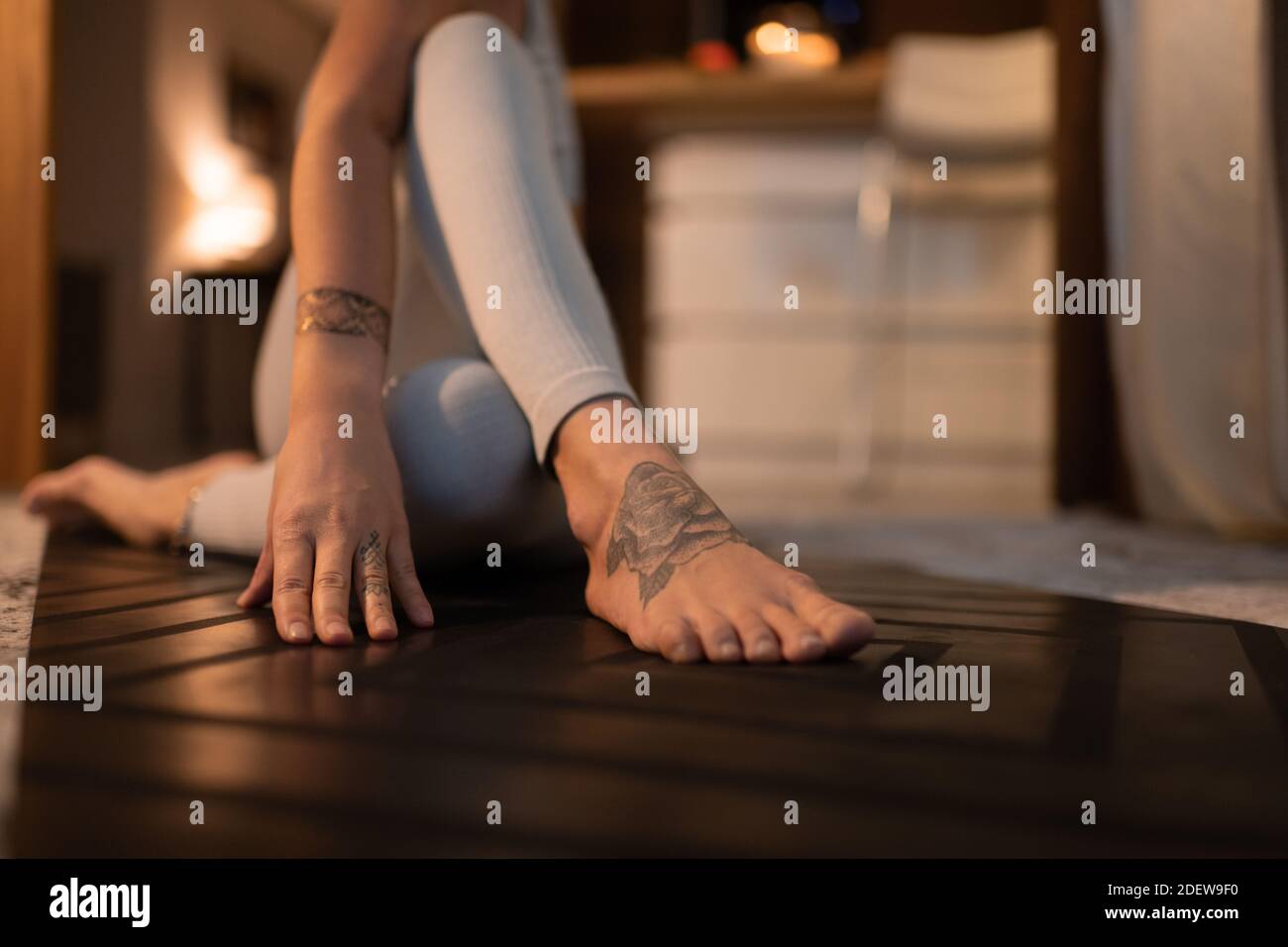 Anonymous barefoot woman Half Lord of the Fishes pose during yoga ...