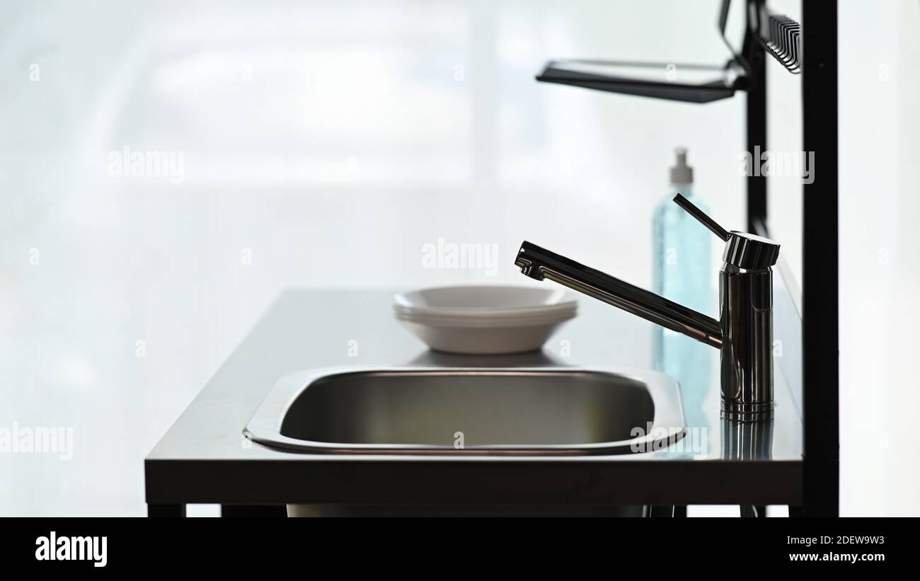 Corner wash in the interior and design of a modern minimalist kitchen ...