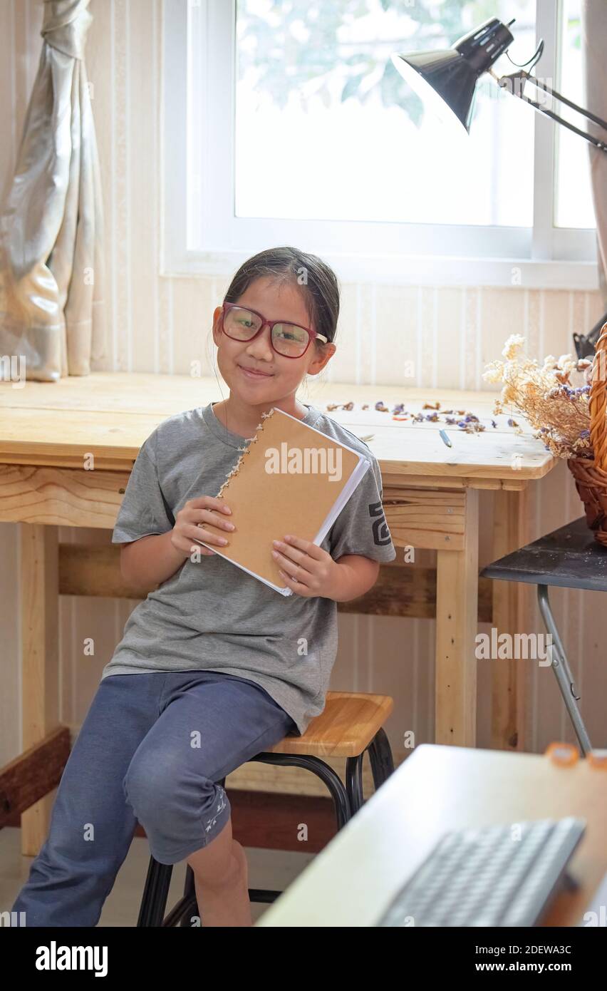 A girl showing her favorite hand book Stock Photo - Alamy