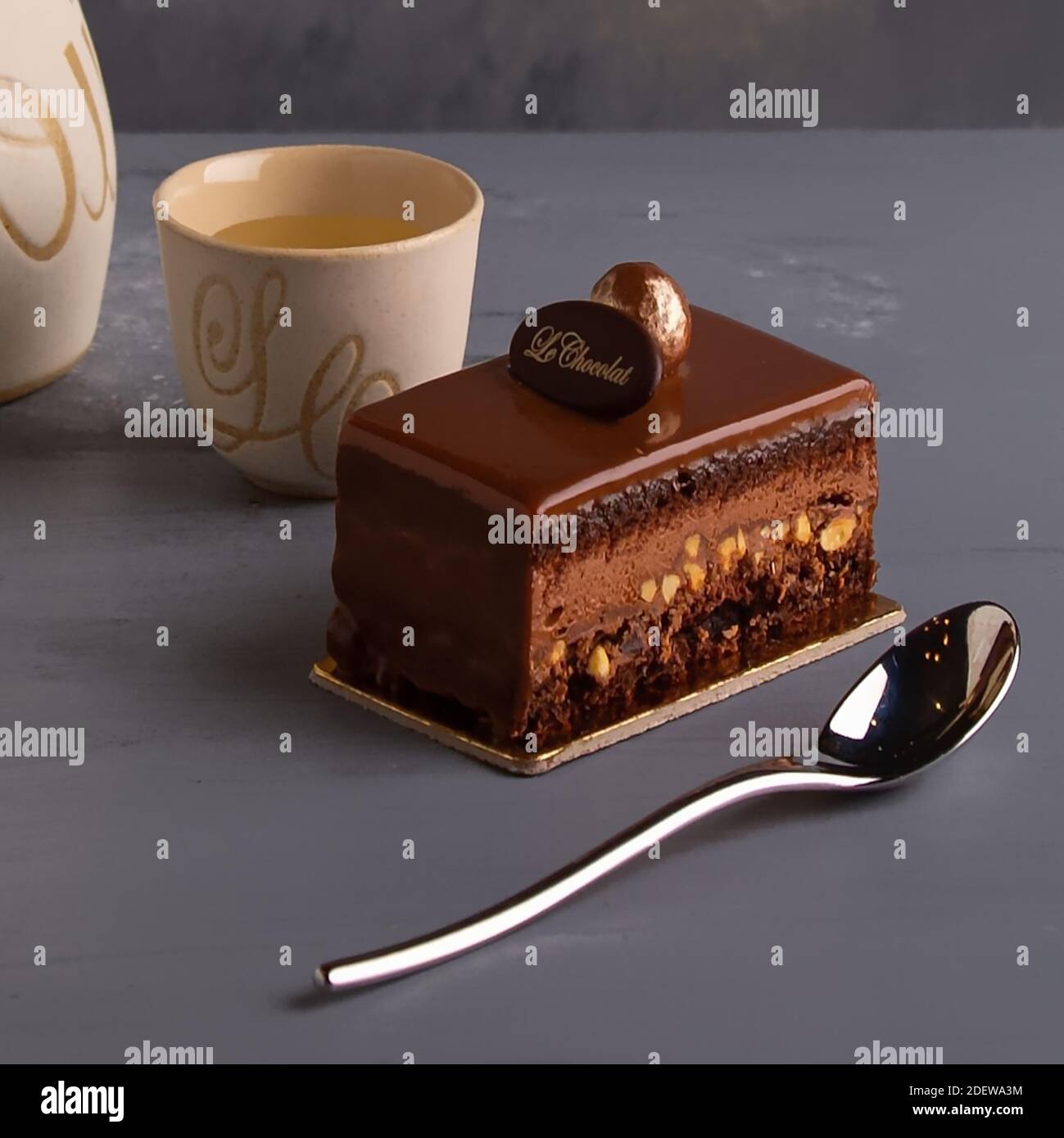Chocolate slice cake with nuts inside Stock Photo - Alamy