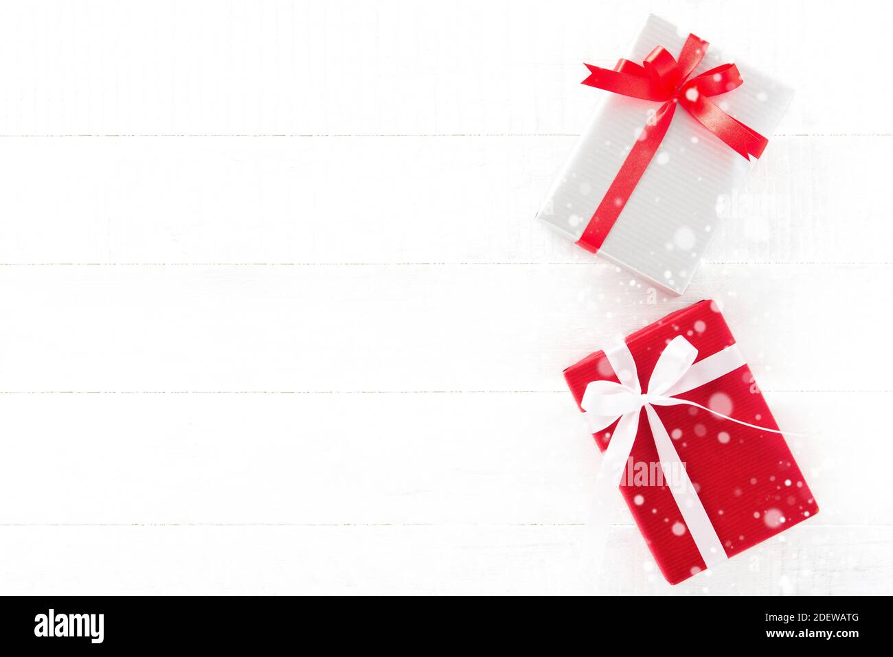 Gift boxes on white wood background, top view, border design with copy ...