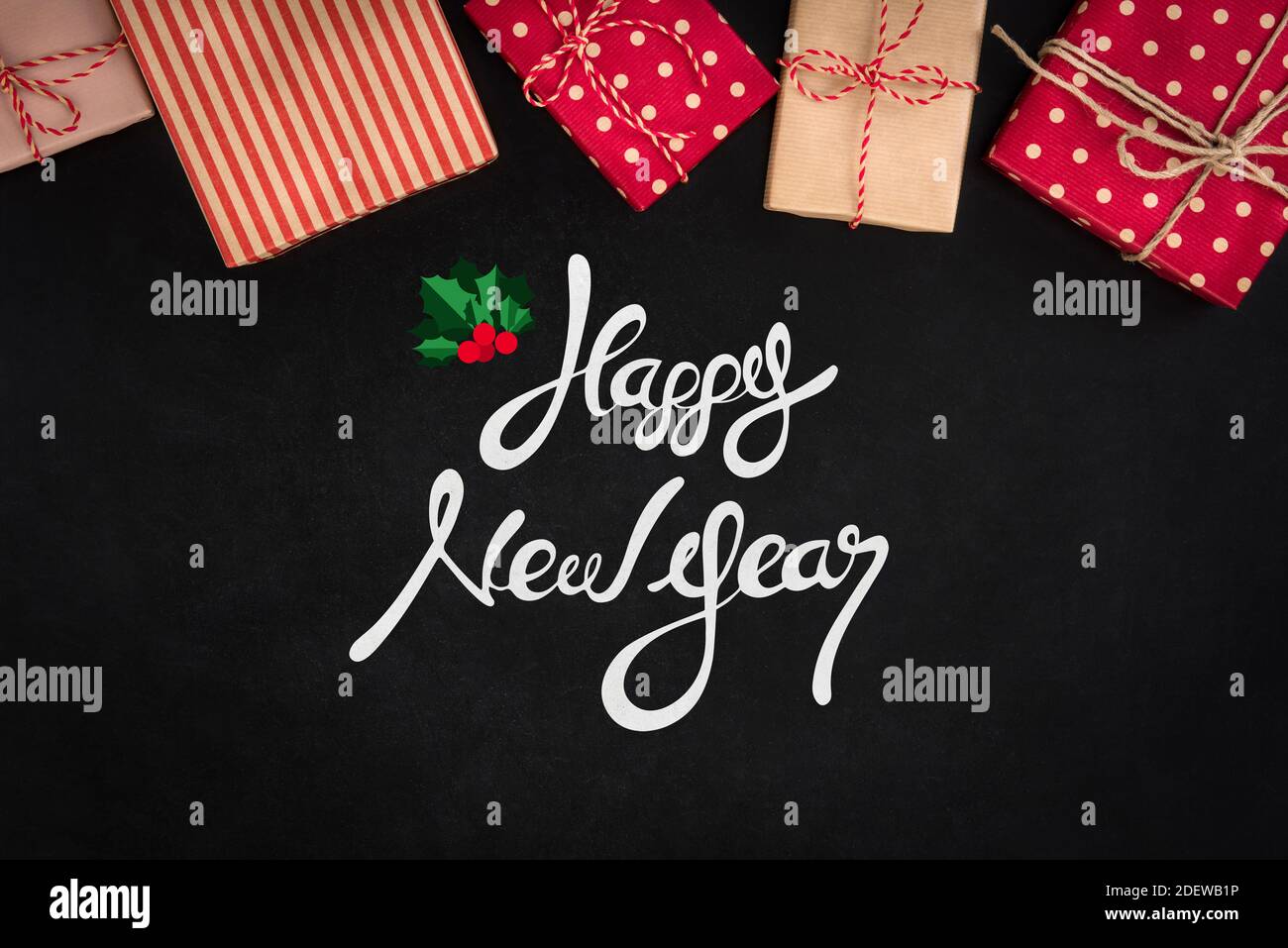 Happy New Year text on blackboard background with gift boxes Stock ...
