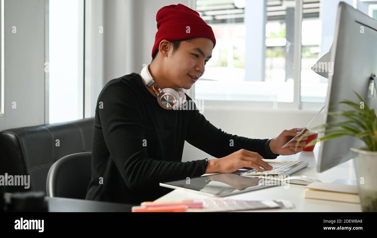 Image of male creative graphic designer is using color selection and ...