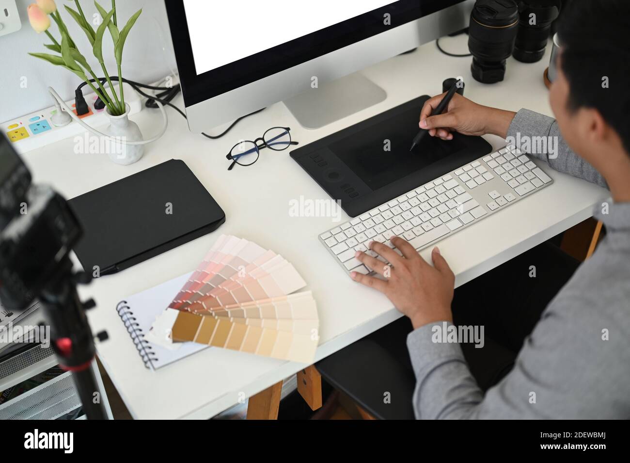 Cropped shot of a male graphic designer working with interactive pen ...
