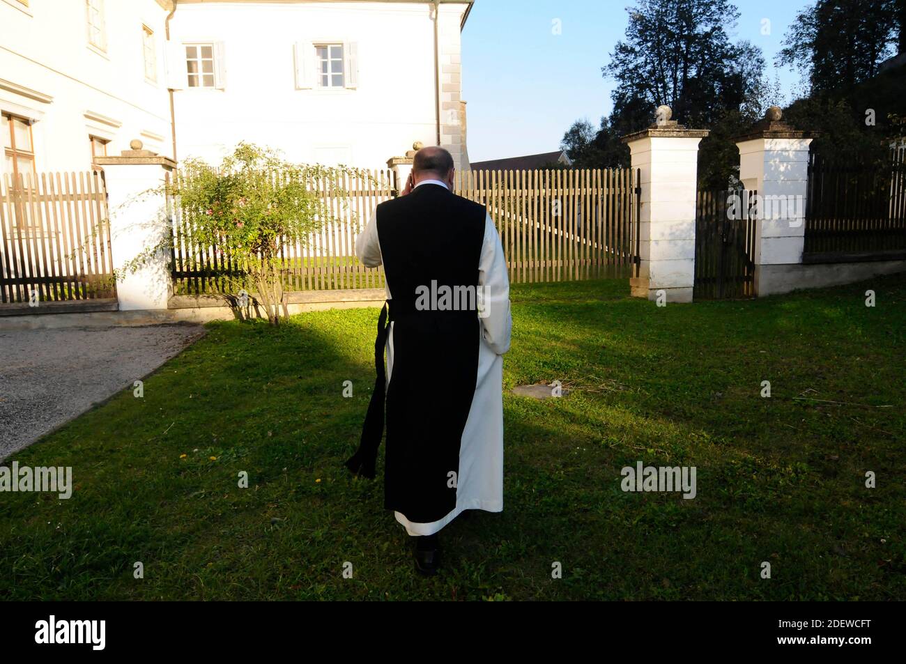 Cistercian Order, monk walking through the garden of a christian faith ...