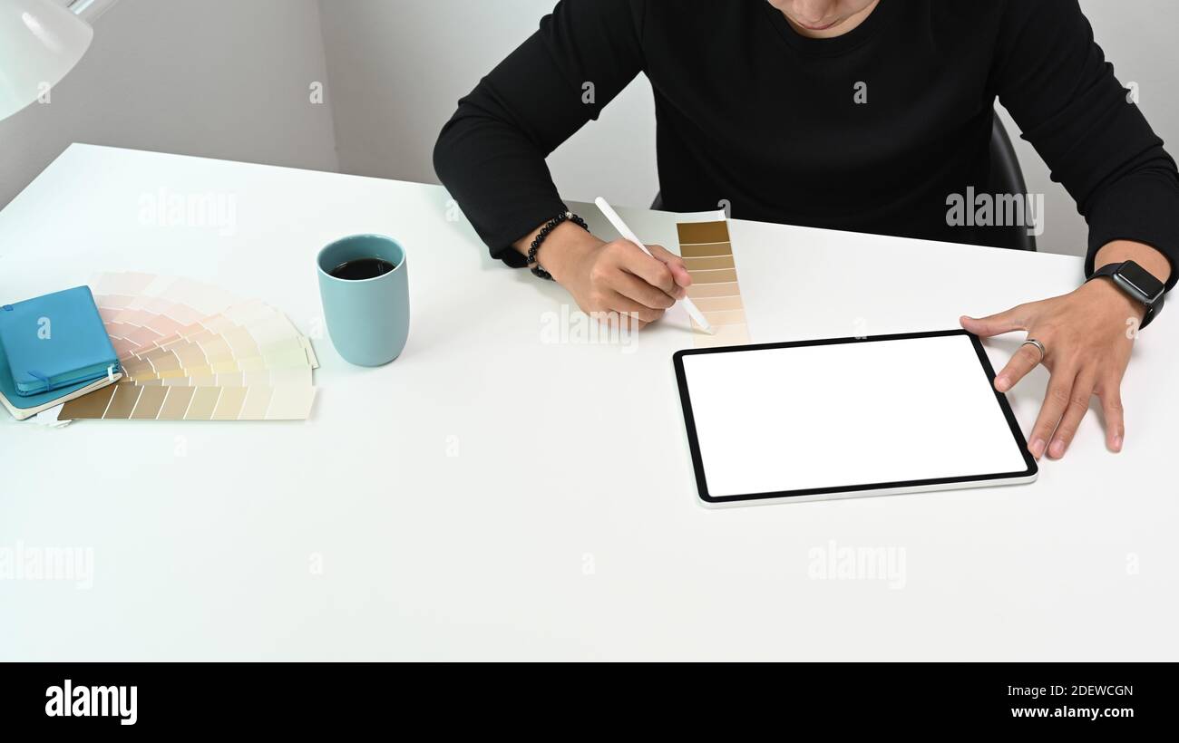 A young creative graphic designer working on project drawing with ...