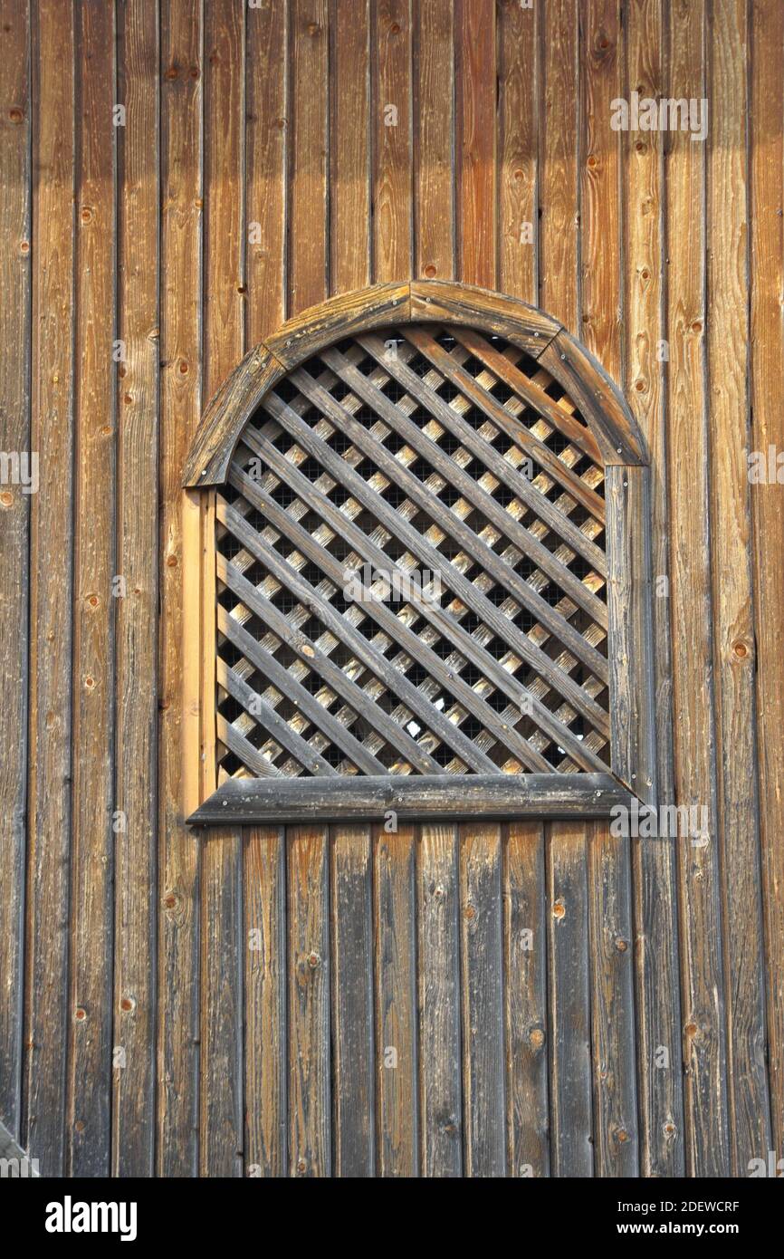 a small wooden window in an old wooden house on the countryside Stock ...