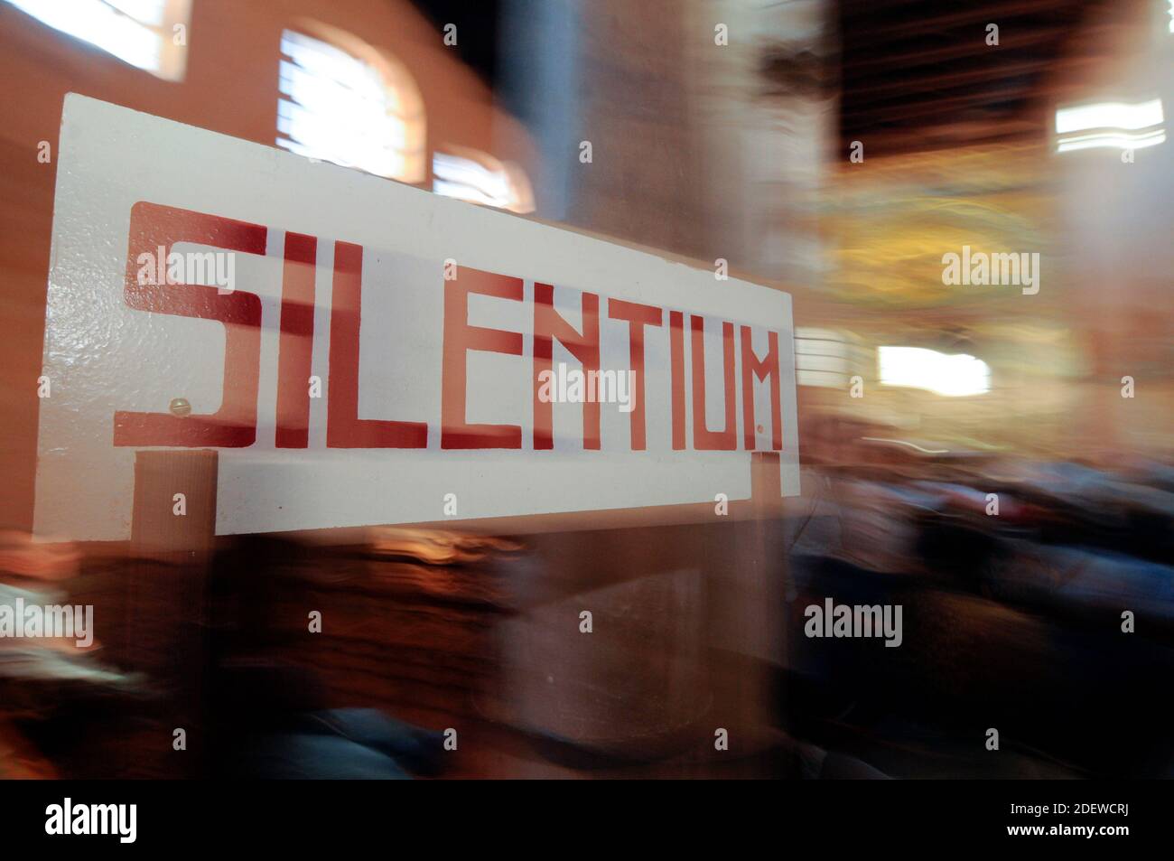 red Silentium sign on white background, request to be quiet, motion ...