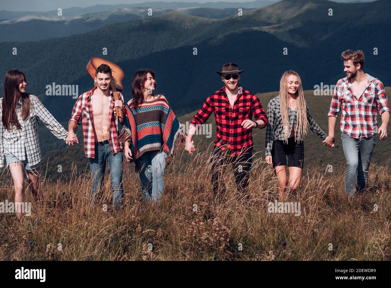 Group of young people walking on summer nature outdoor. Groups of ...