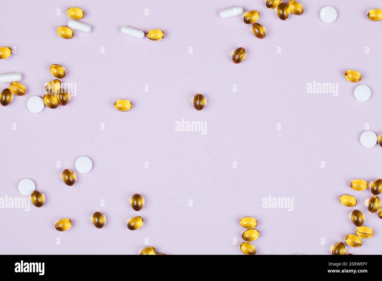 Close up vitamins and supplements on purple background. Including ...