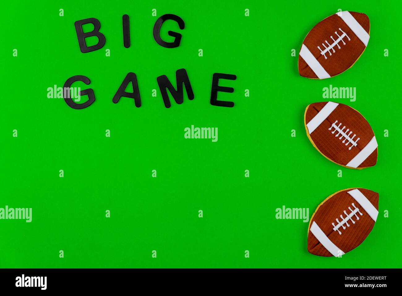 Rugby ball cookie with text big game on green background. American ...