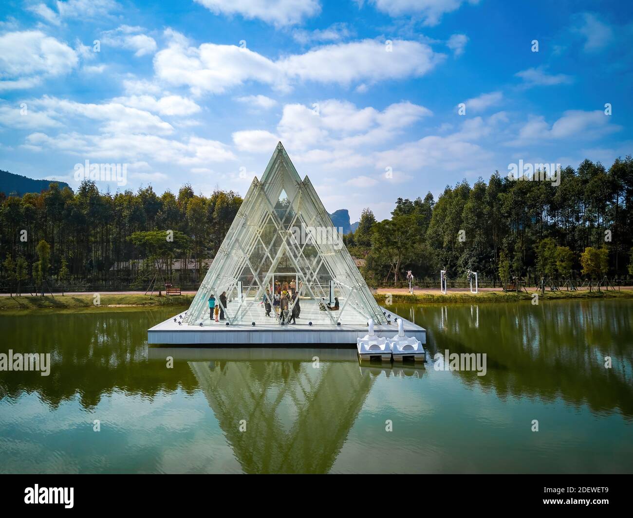 Glass house triangle church by the lake Stock Photo - Alamy