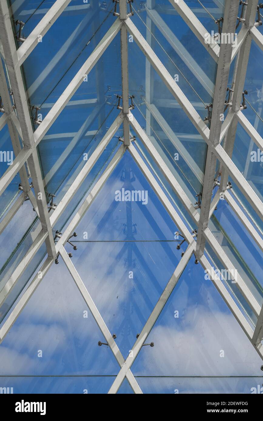 Internal roof structure of a triangular glass house Stock Photo - Alamy