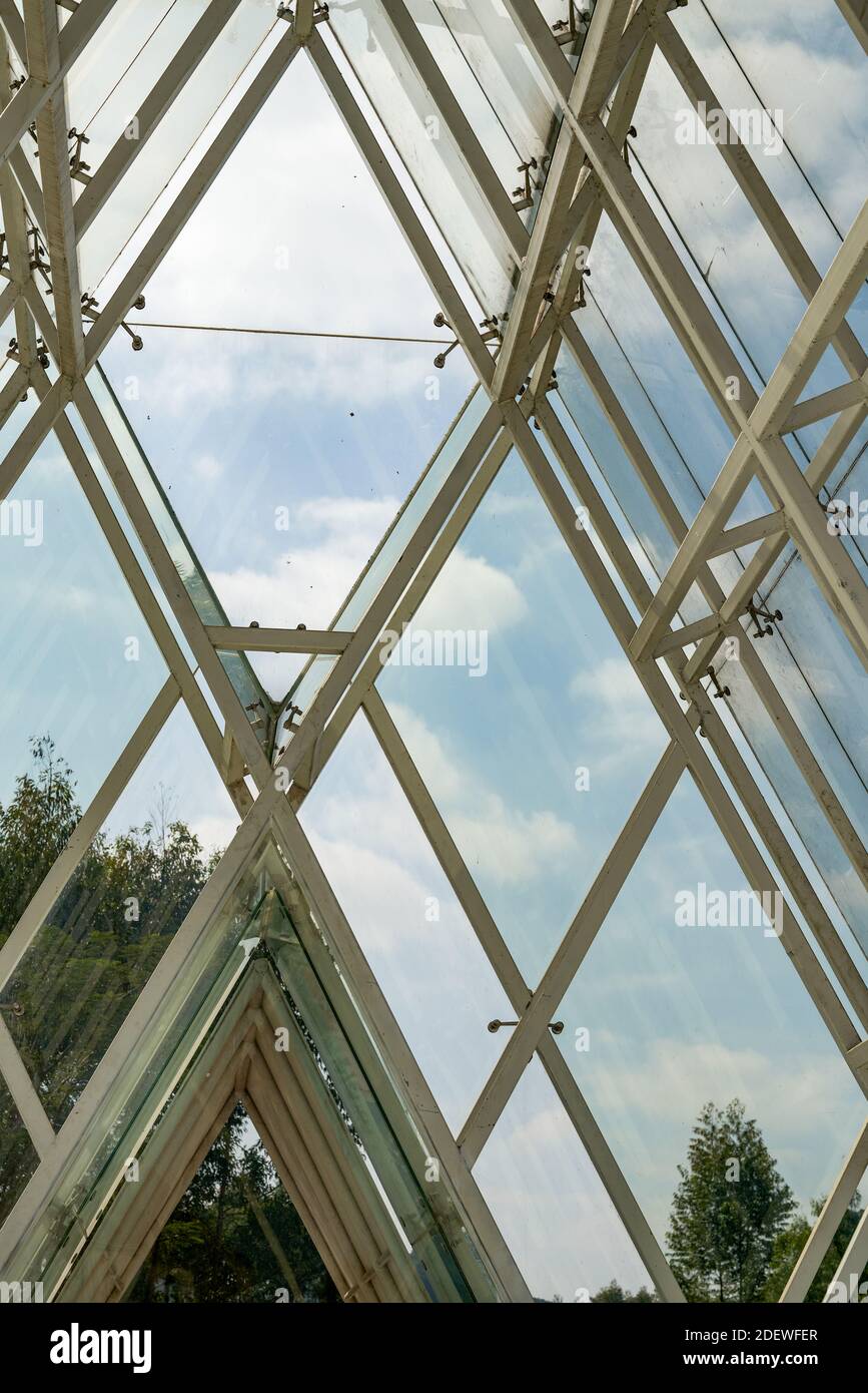 Internal roof structure of a triangular glass house Stock Photo - Alamy