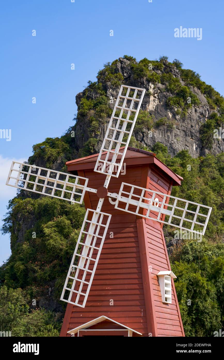 Brick red windmill in European country countryside Stock Photo - Alamy