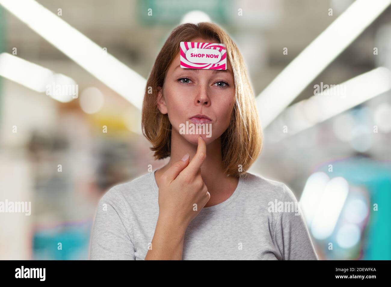 Finance and banking. Portrait of a young blonde who has a Bank card ...