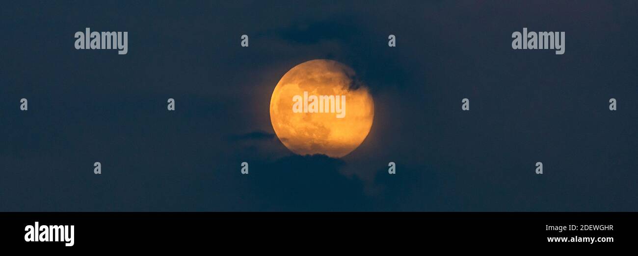 Bright Yellow Full Moon in clouds. Nature skyscape Stock Photo - Alamy
