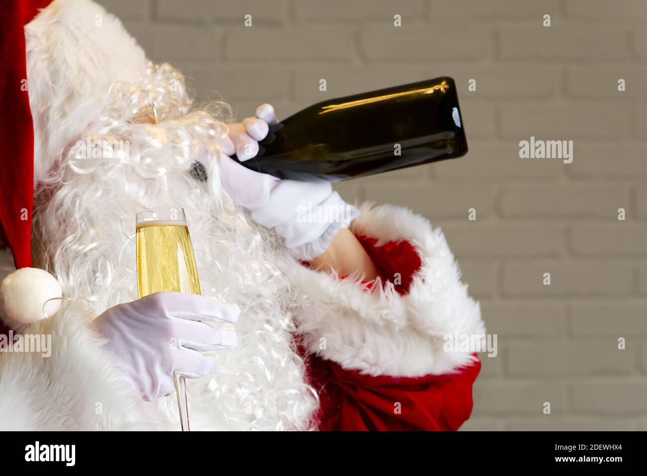 Santa claus drinking sparkling wine from bottle. drunk santa claus ...